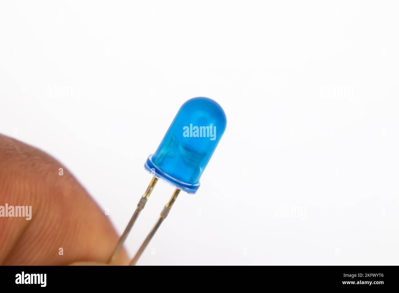 A hand held blue LED on a white background. This part is used for ...
