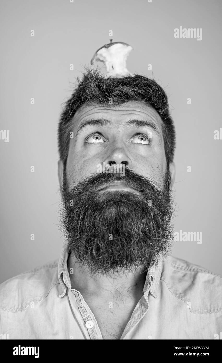 Live target concept. Man handsome hipster long beard almost eaten apple ...