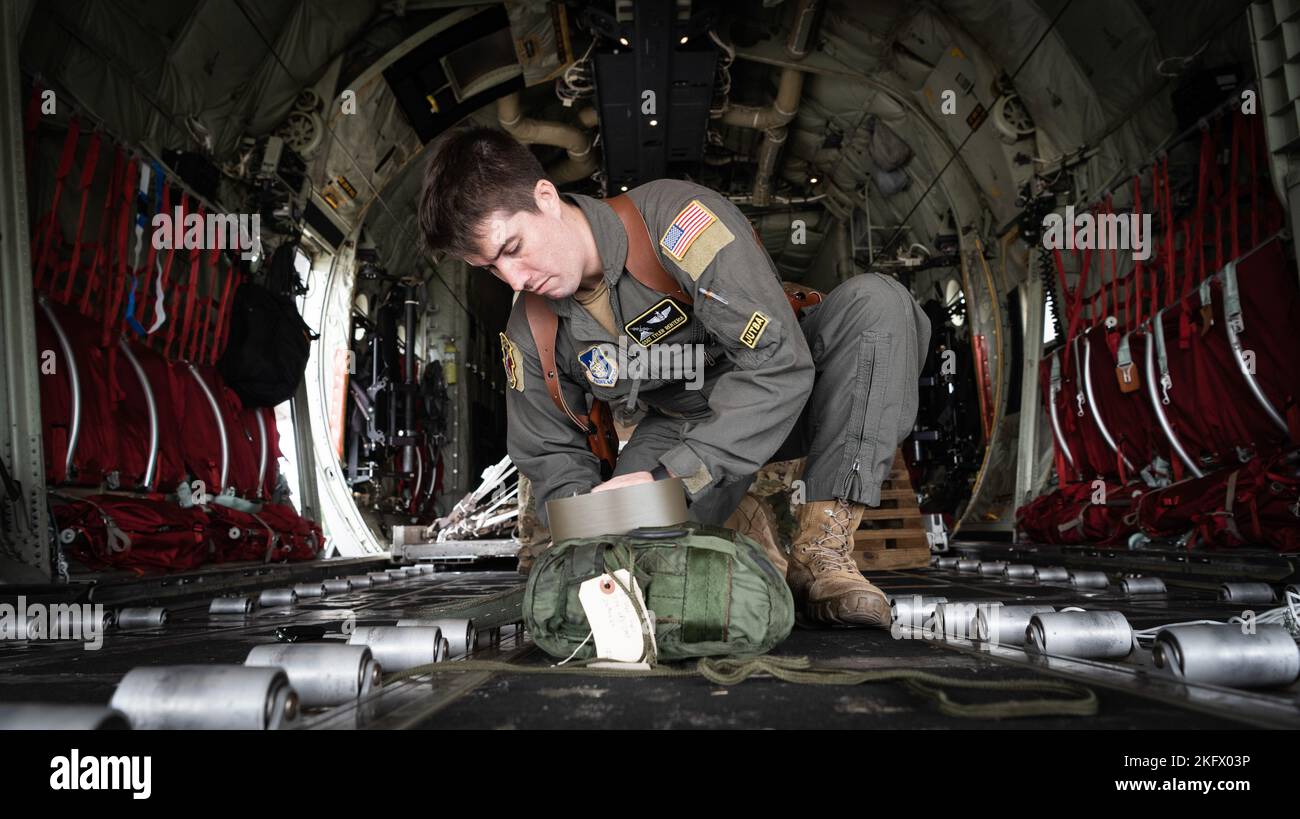 Staff Sgt. Tyler Renteria, 36th Airlift Squadron loadmaster, prepares to rig a heavy equipment ...