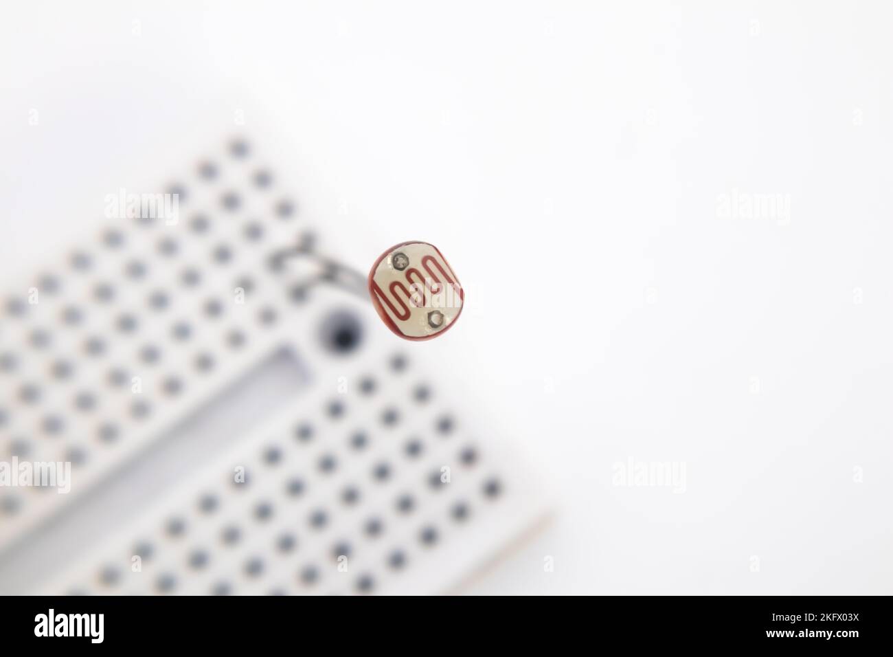 An LDR (Light Dependent Resistor) embedded in a project board on a ...