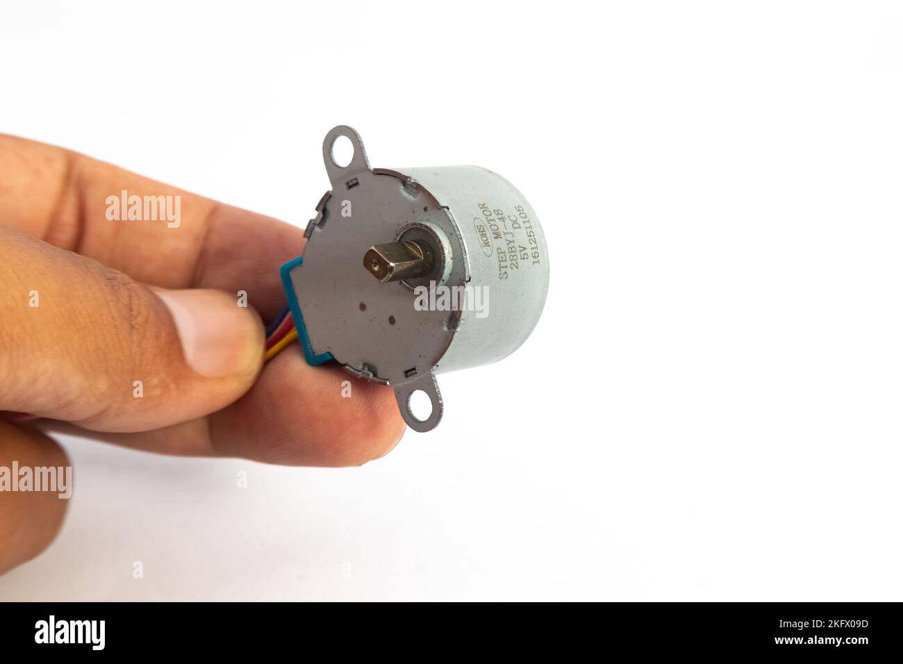 Front side view of a hand held step motor module. This module is used ...