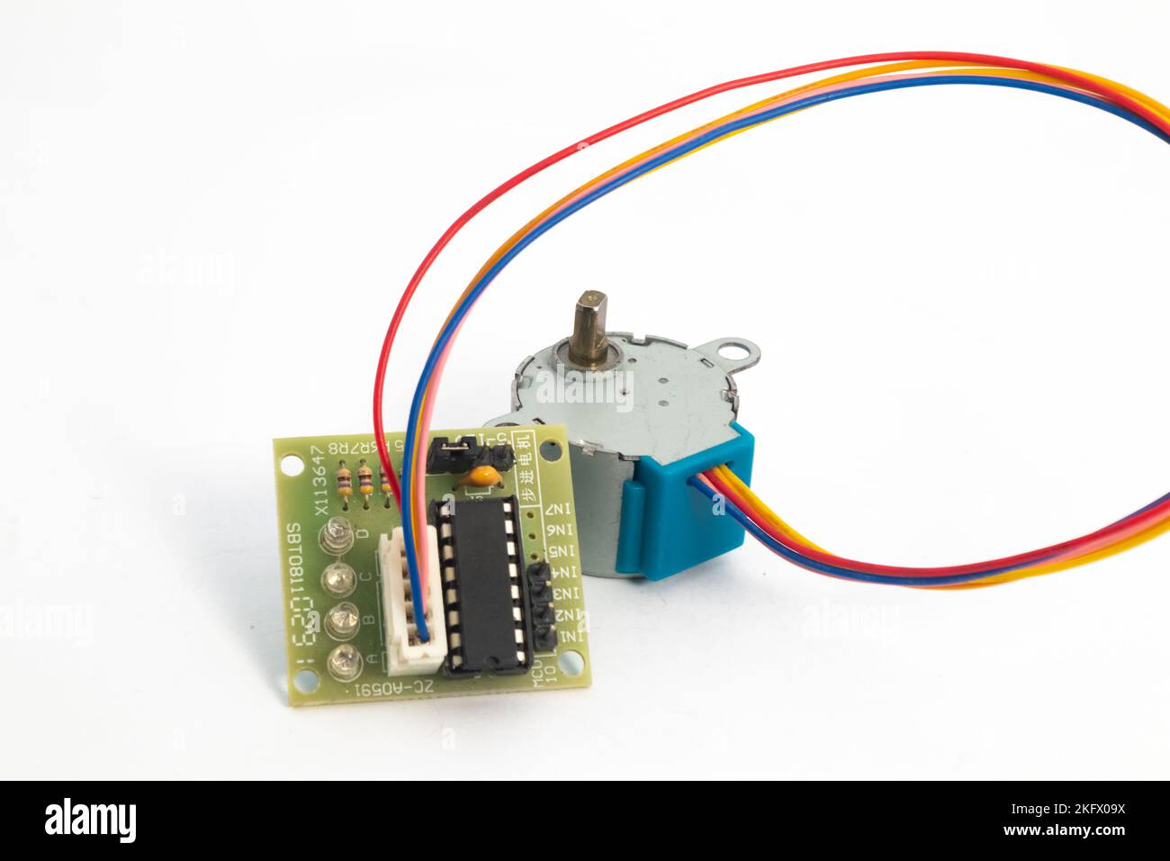 Rear view of a step motor module and its driver module connected by ...