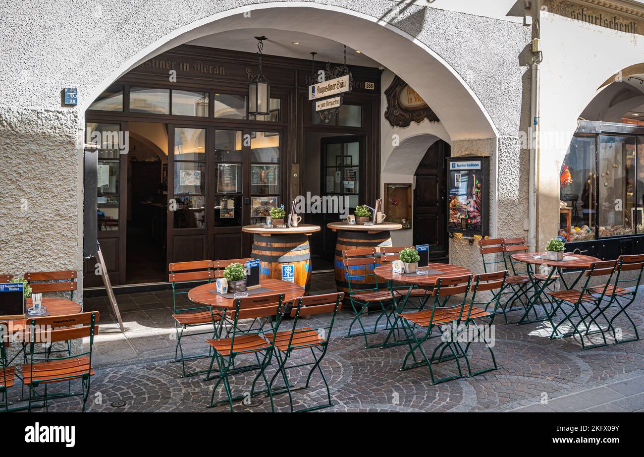 A sidewalk beer garden in Laubengasse the main shopping street in the ...