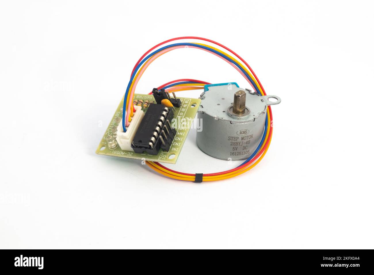 Front view of a step motor module and its driver module connected by ...