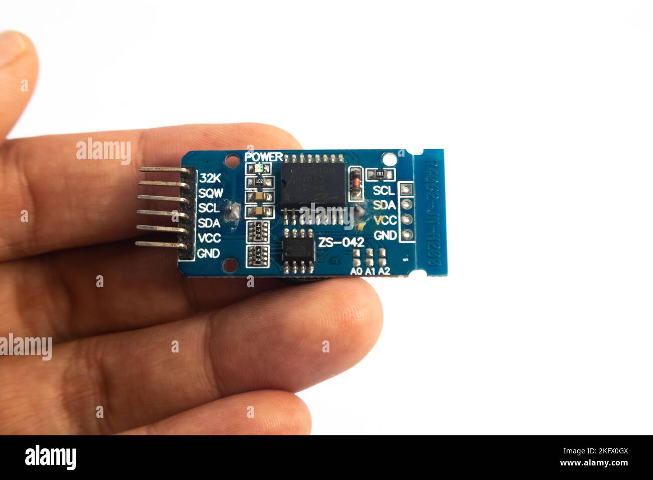 A ZS-042 RTC (Real Time Clock) module held in hand. This module is used ... A ZS-042 RTC (Real Time Clock) module held in hand. This module is used ...