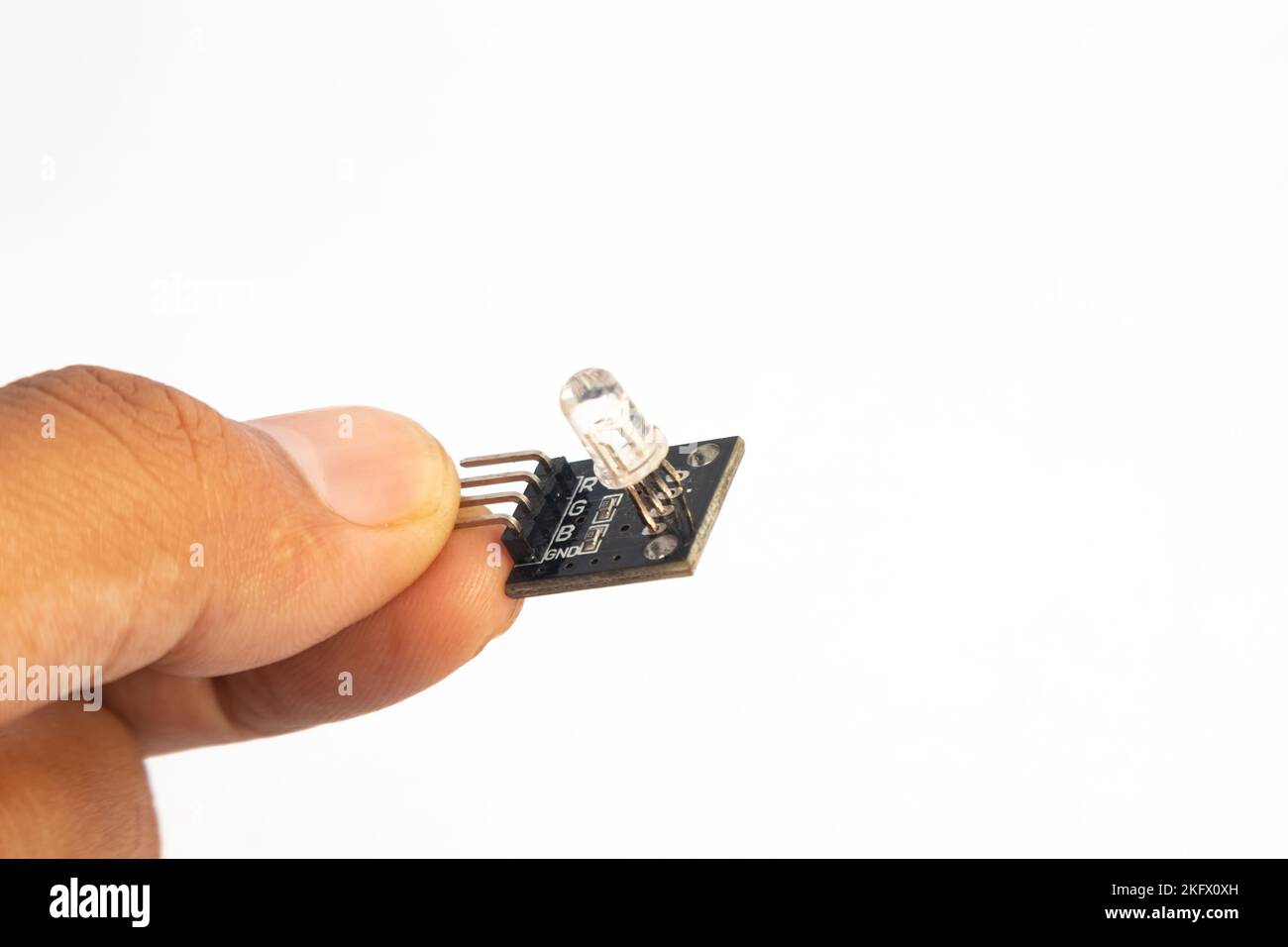 A closeup of an RGB LED module in hand. This module is used for ...