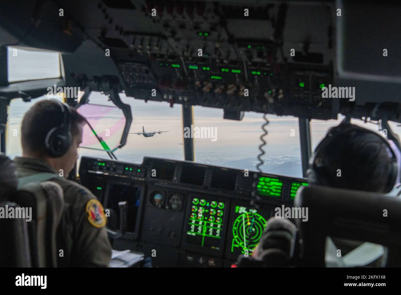 U.S. Air Force Capt. Andres Fedele, C-130J Super Hercules aircraft commander (left) and U.S. Air ...