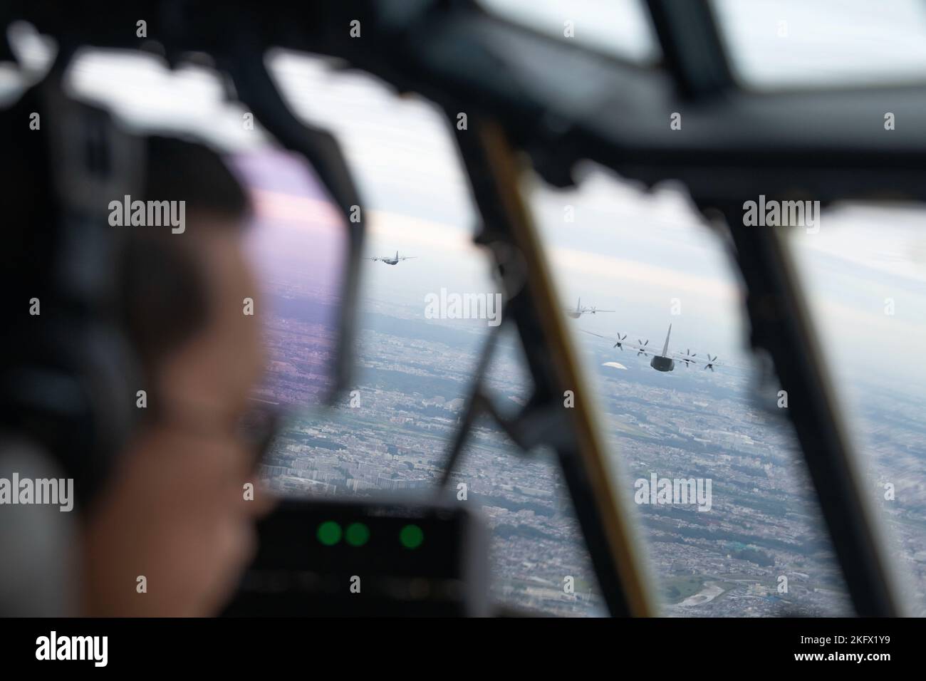 U.S. Air Force 1st Lt. Brian Tang, C-130J Super Hercules pilot surveys ...