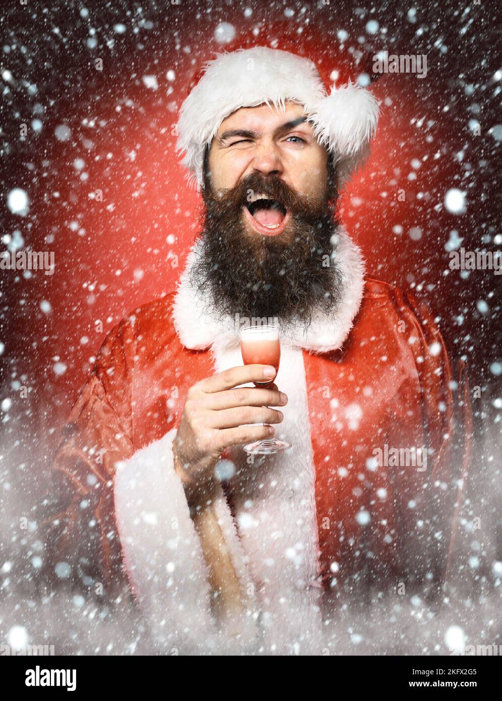 handsome bearded santa claus man with long beard on funny face holding ...