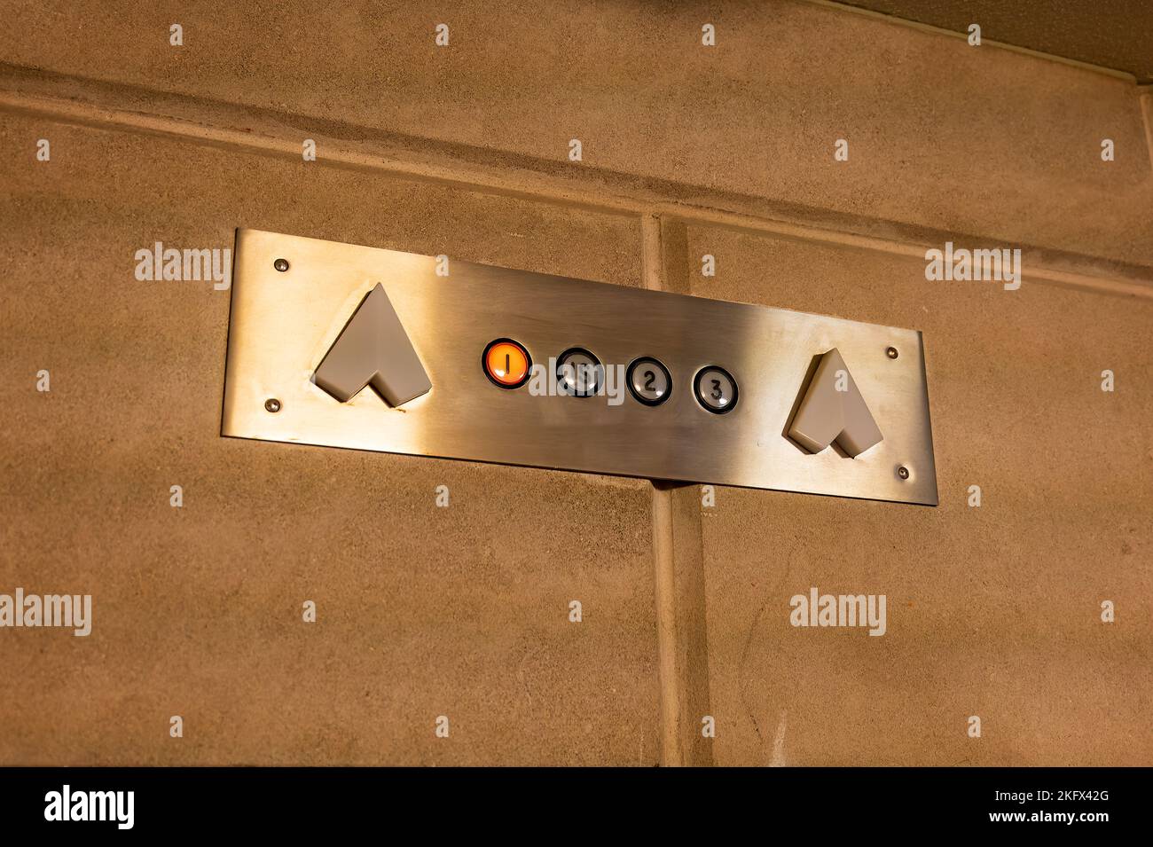 Elevator panel communicating direction and floor of active elevator car ...