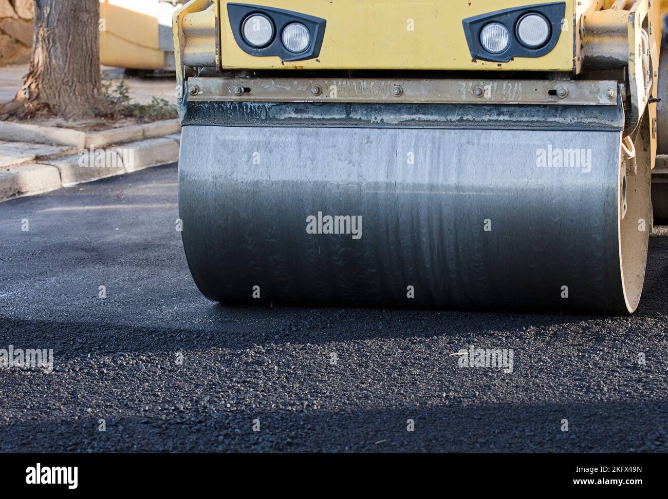 Road roller and asphalt paving machine at construction site Stock Photo ...