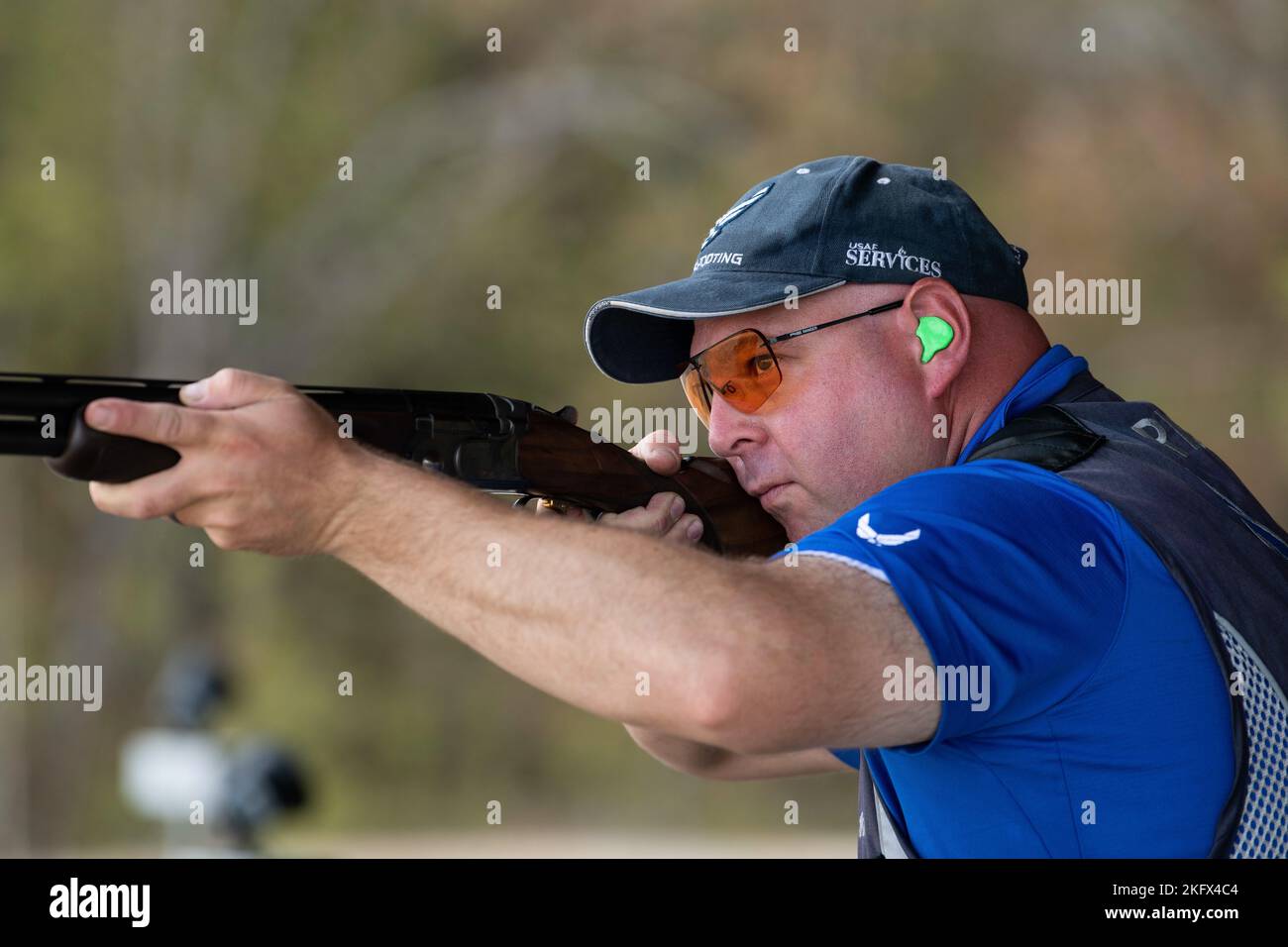 U.S. Air Force Major Daniel Rich, Air Force Services Center, aims his ...