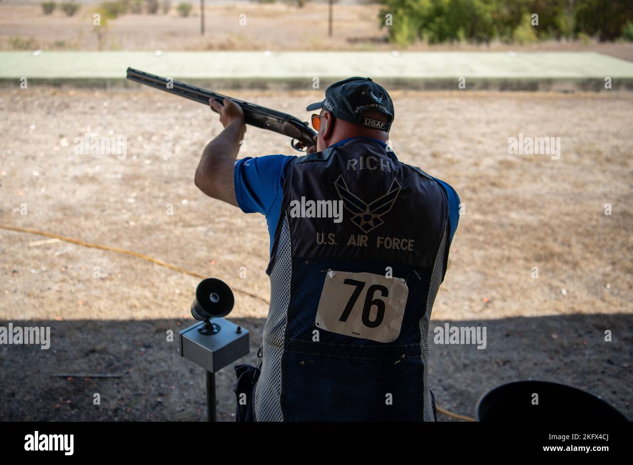 U.S. Air Force Major Daniel Rich, Air Force Services Center, aims his ...
