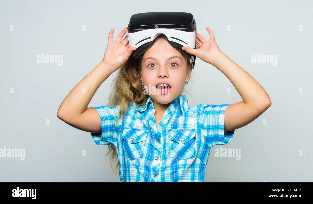 Digital future and innovation. Little child in VR headset. Happy kid ...