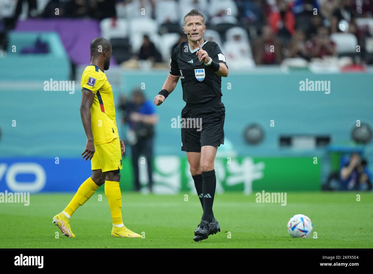 The referee signals a penalty during the Qatar 2022 World Cup match ...