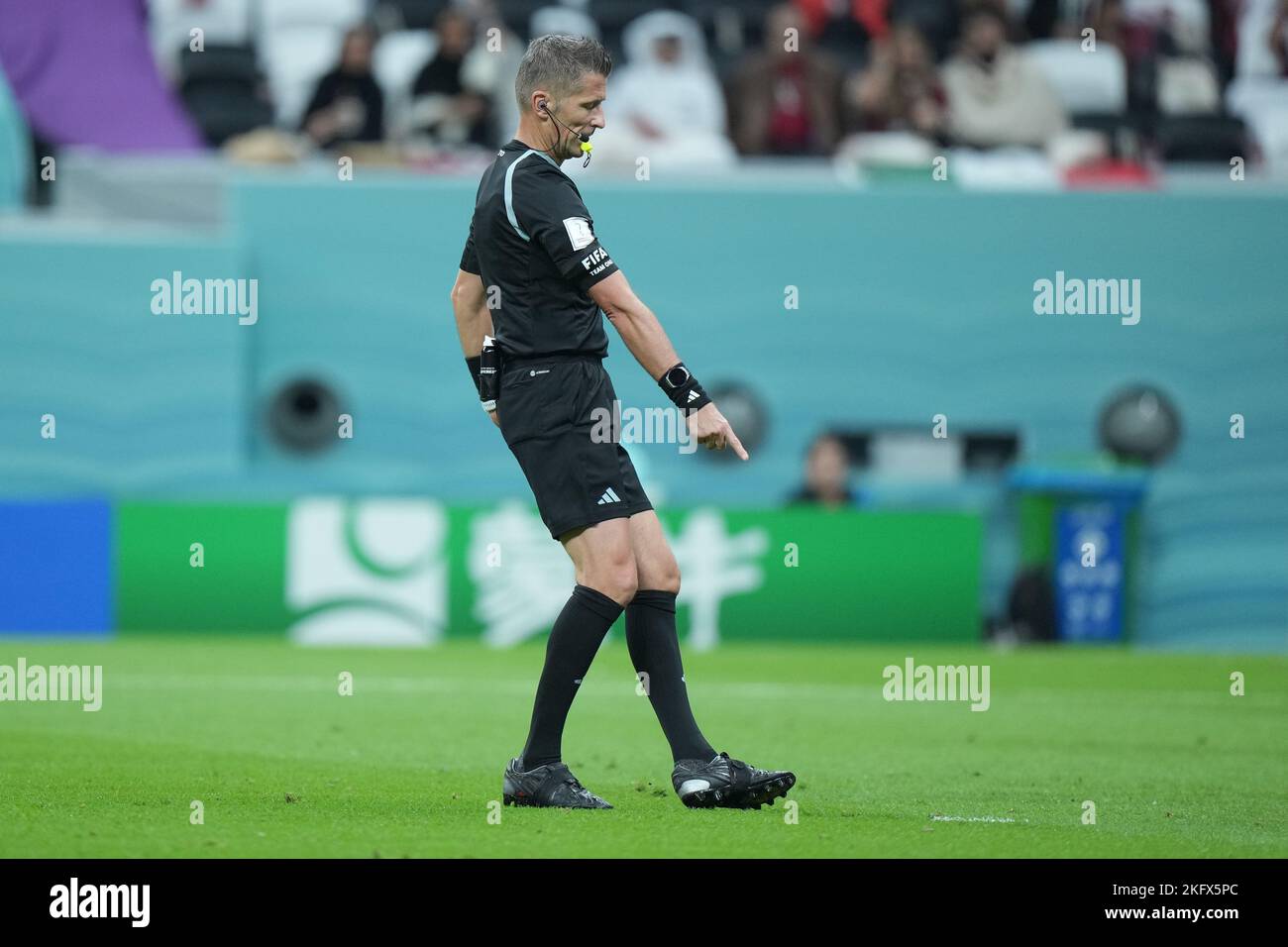 The referee signals a penalty during the Qatar 2022 World Cup match ...