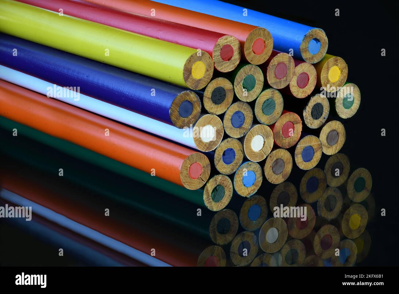 Colored Pencil Bundle on dark glass Stock Photo - Alamy