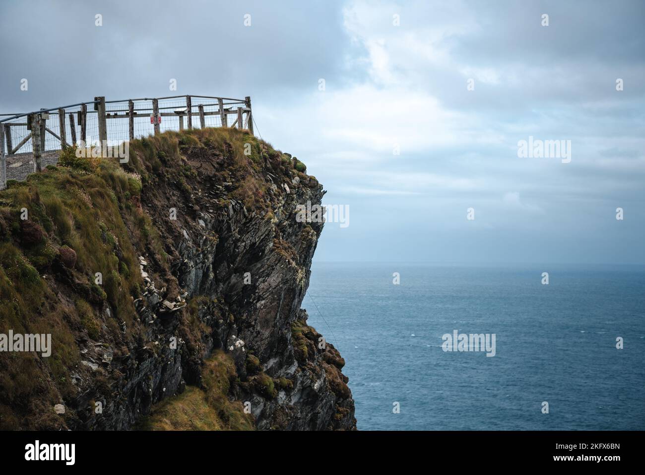 Kerry cliffs with green grass and dramatic clouds in cloudy autumn day ...