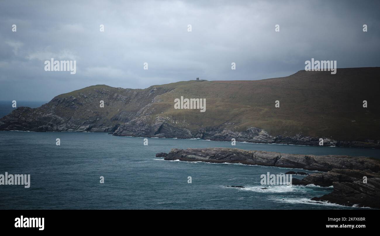 Kerry cliffs with green grass and dramatic clouds in cloudy autumn day ...