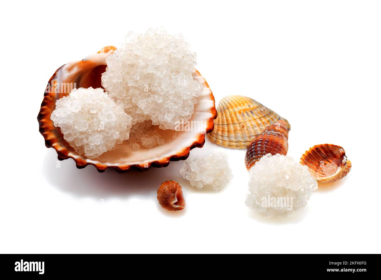 Sea salt with shells on a white background close-up. salt isolate Stock ...