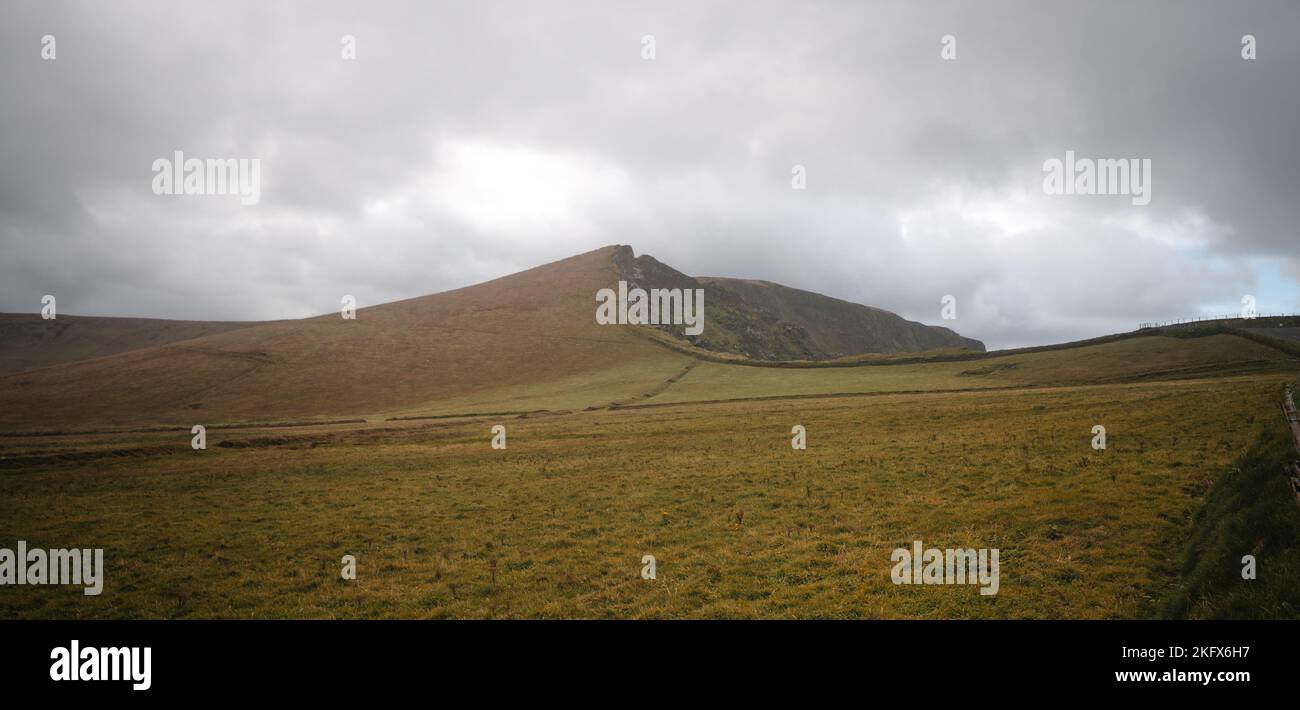 Kerry cliffs with green grass and dramatic clouds in cloudy autumn day ...