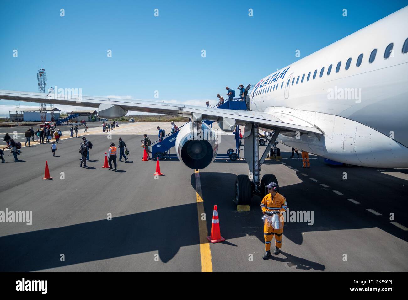Passengers disembarking from a Latam plane, Seymour Airport, Galapagos ...