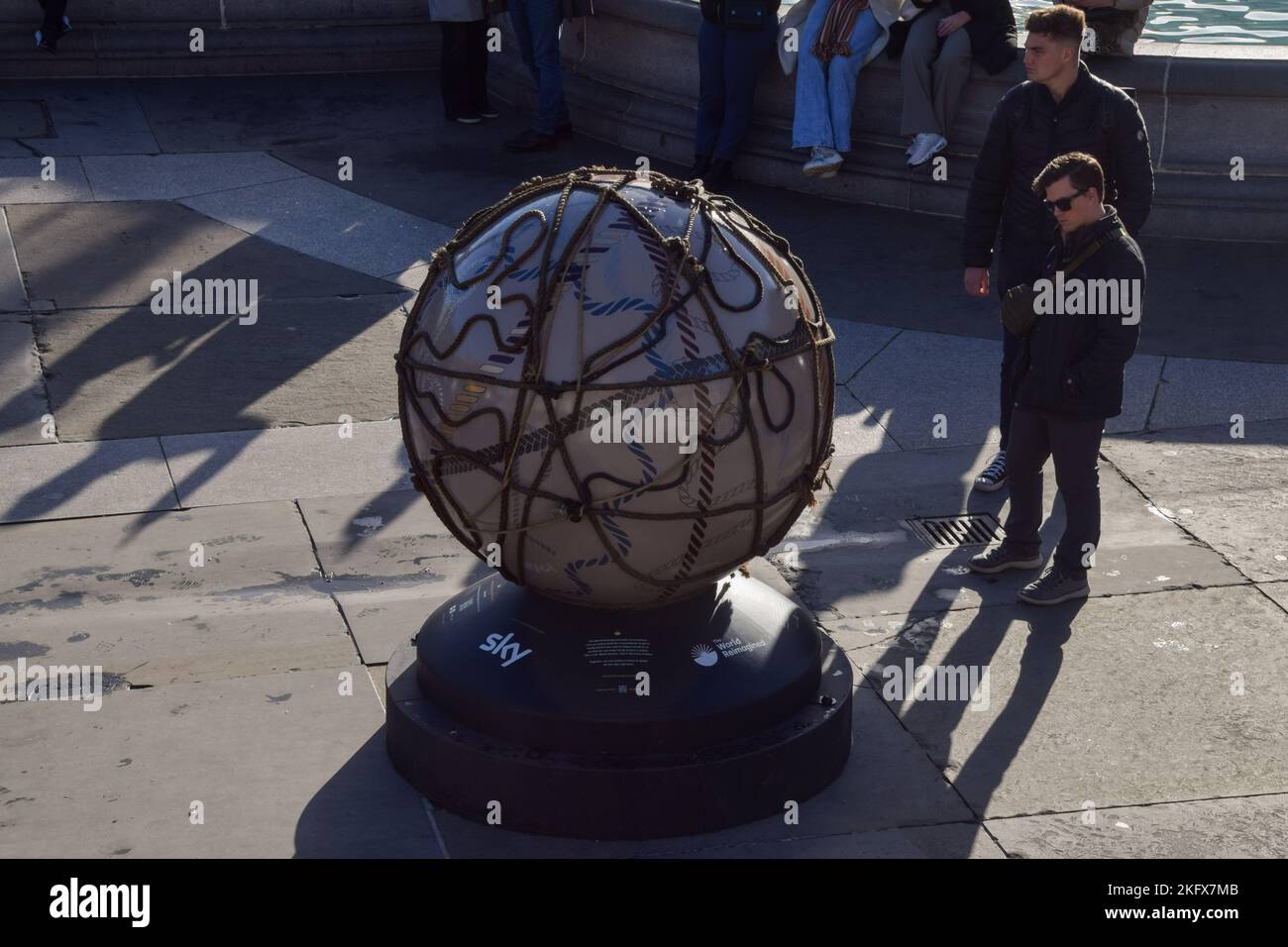 Visitors admire a globe exhibited on Trafalgar Square, London. 96 ...