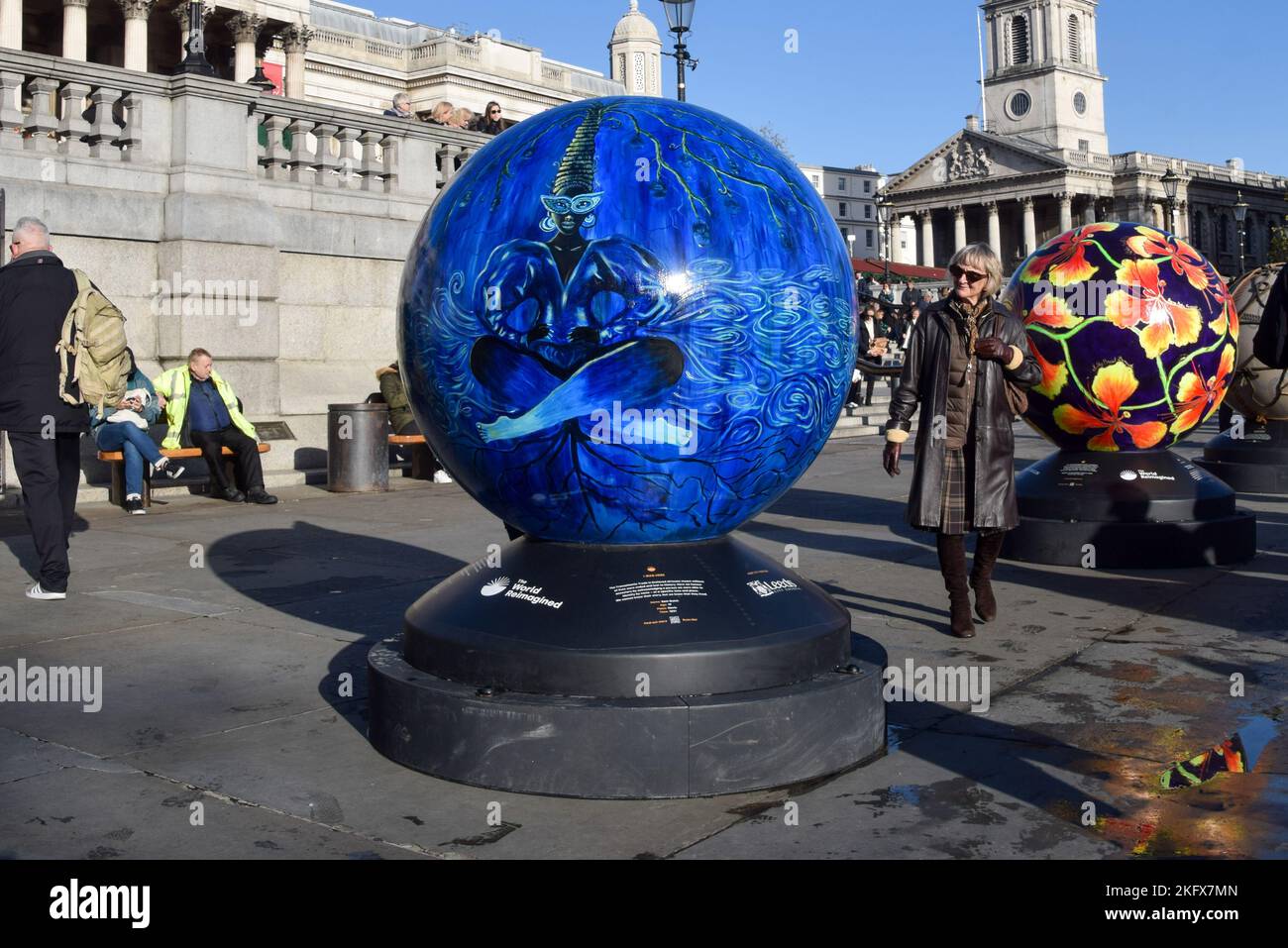 A visitor admires a globe exhibited on Trafalgar Square, London. 96 ...