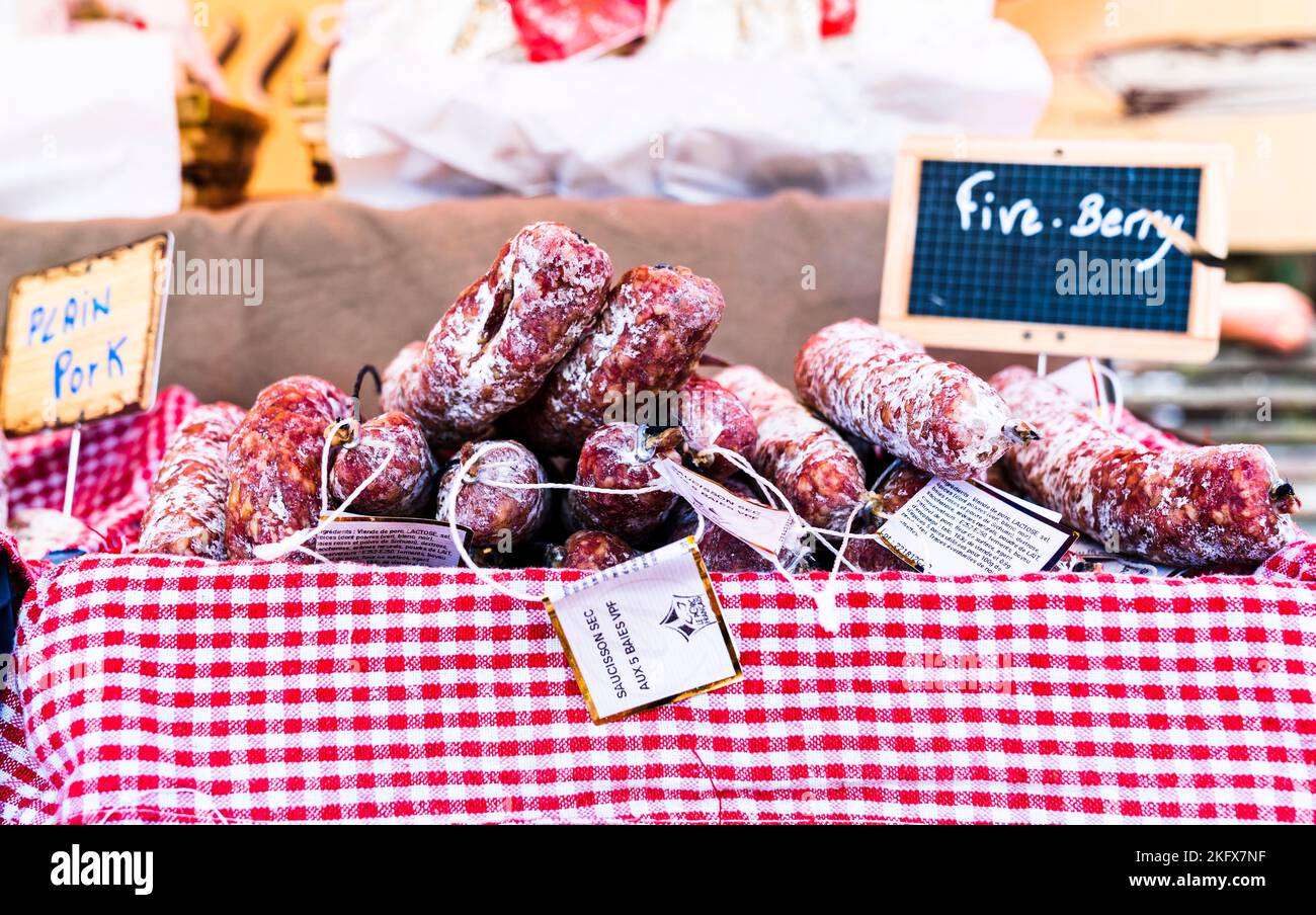 Red and white clothe with French dried meat saucisson sec sausages ...
