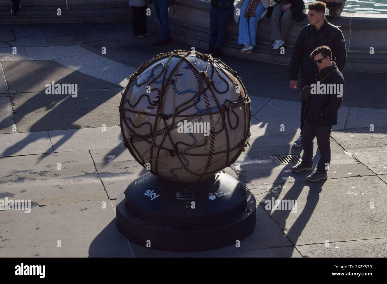 London, UK. 20th Nov, 2022. Visitors admire a globe exhibited on ...