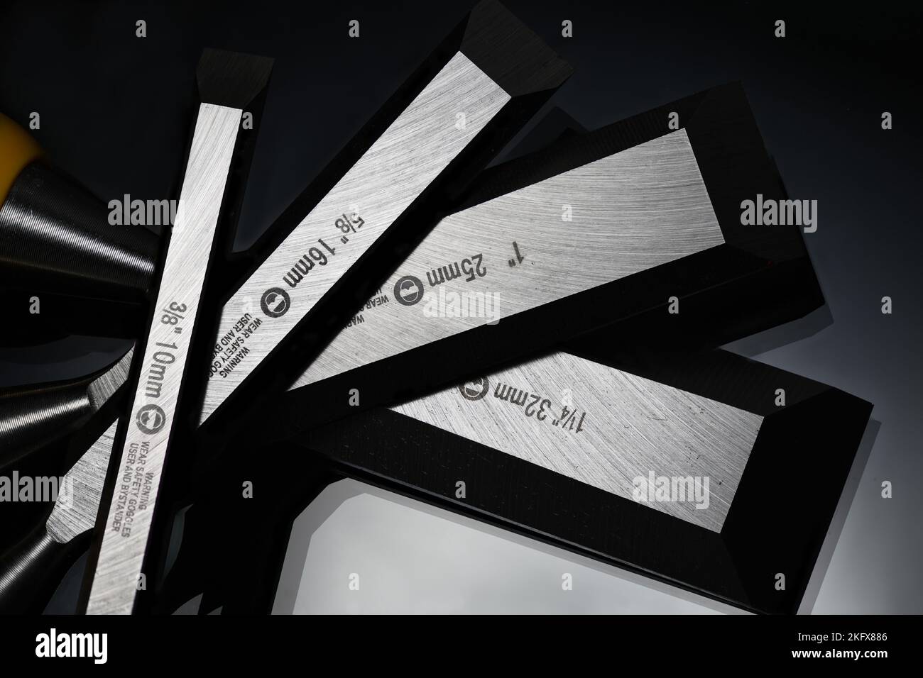 Wood Chisel close up on dark glass Stock Photo - Alamy