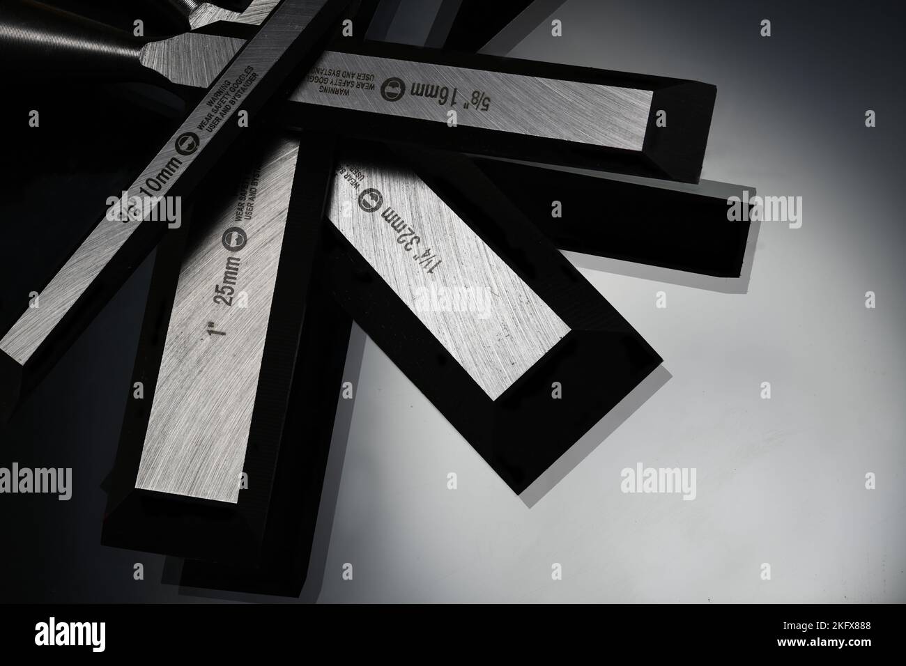 Wood Chisel close up on dark glass Stock Photo - Alamy