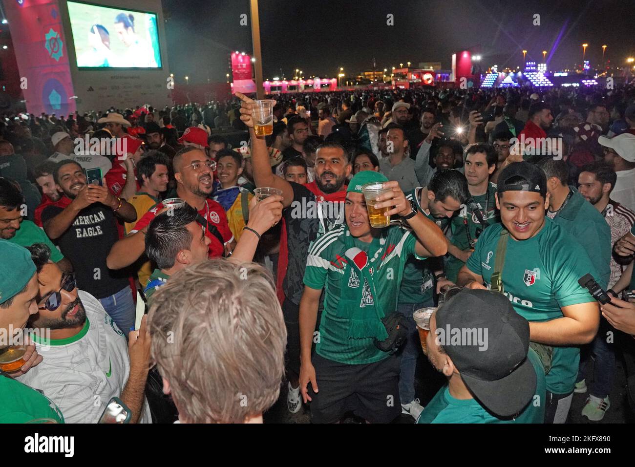 Mexican and Dutch fans enjoy a beer at the FIFA Fan Festival in Al ...