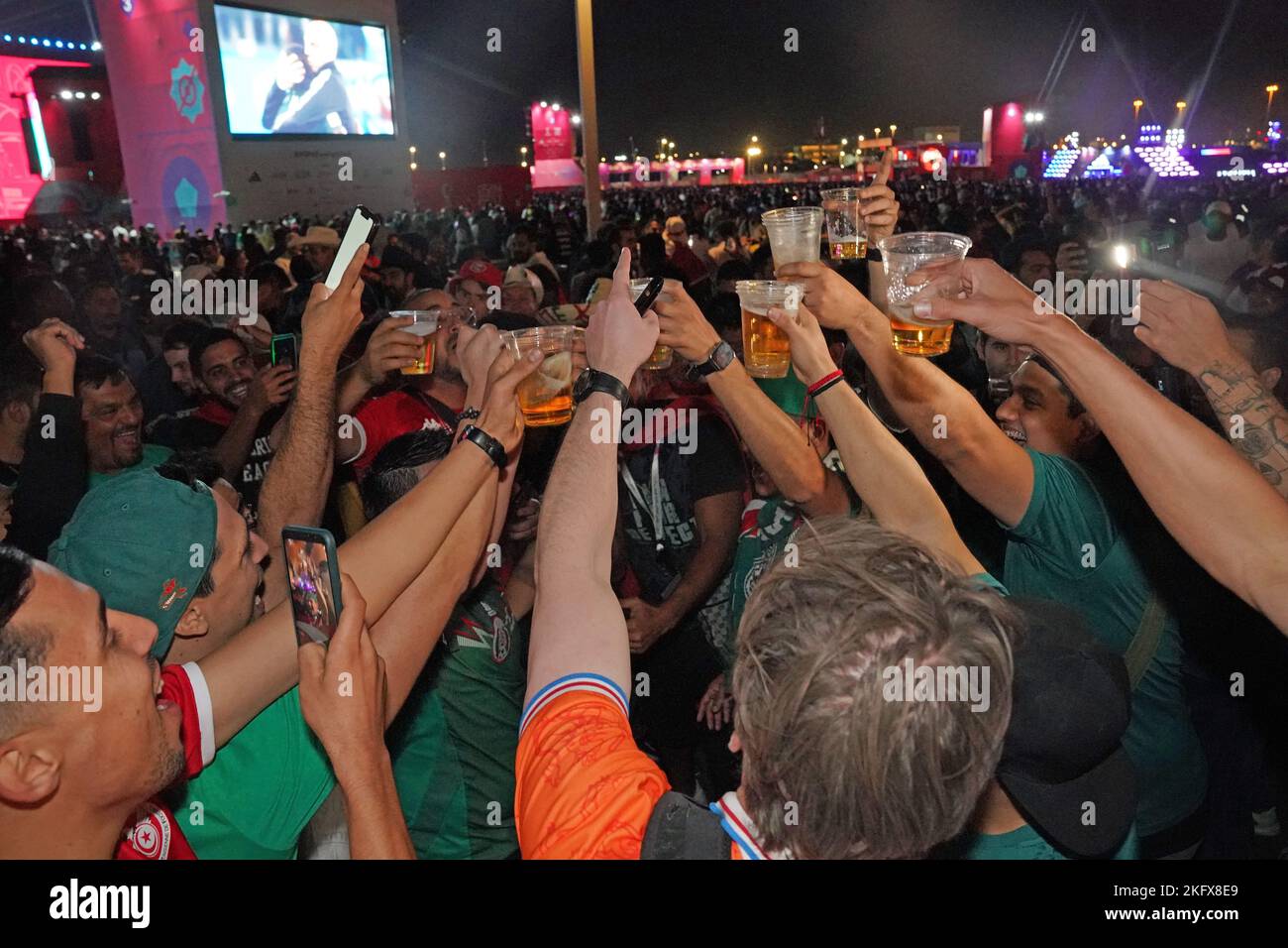 Mexican and Dutch fans enjoy a beer at the FIFA Fan Festival in Al ...