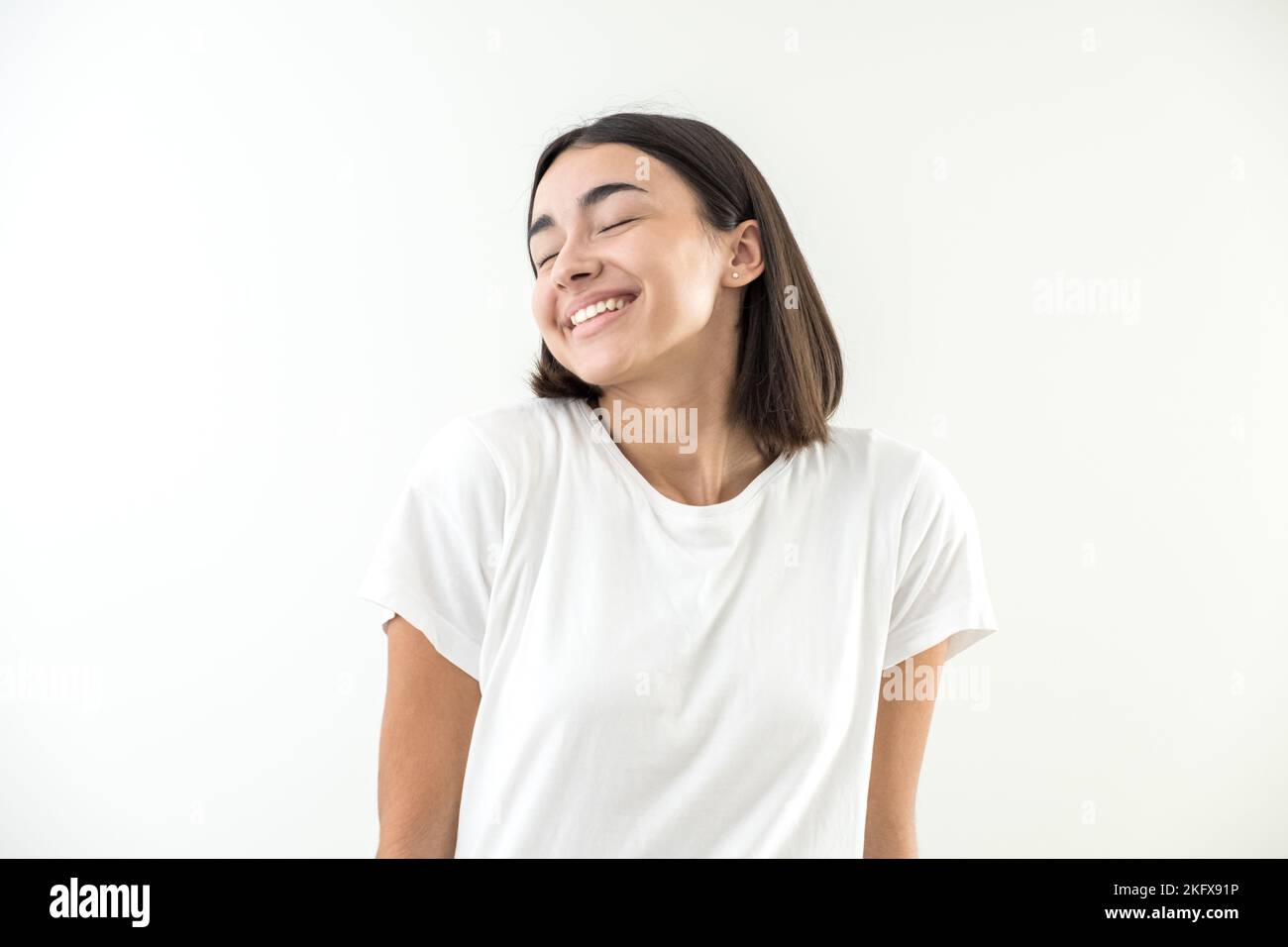 Young girl happy smile eyes closed calmly and quietly. Dream, think and ...