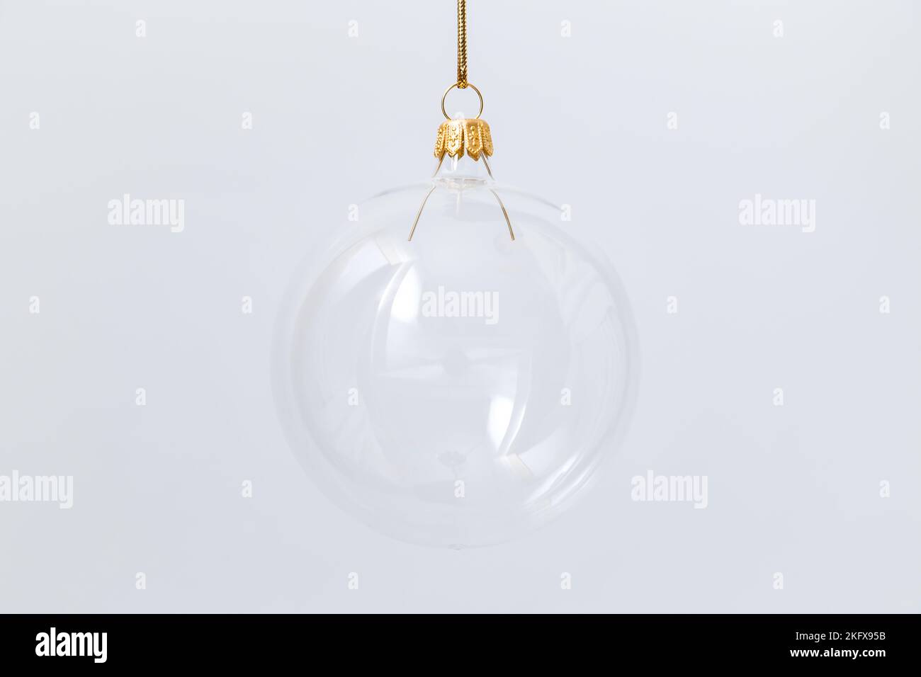 Transparent glass Christmas ball on white backdrop. Trendy Christmas ...