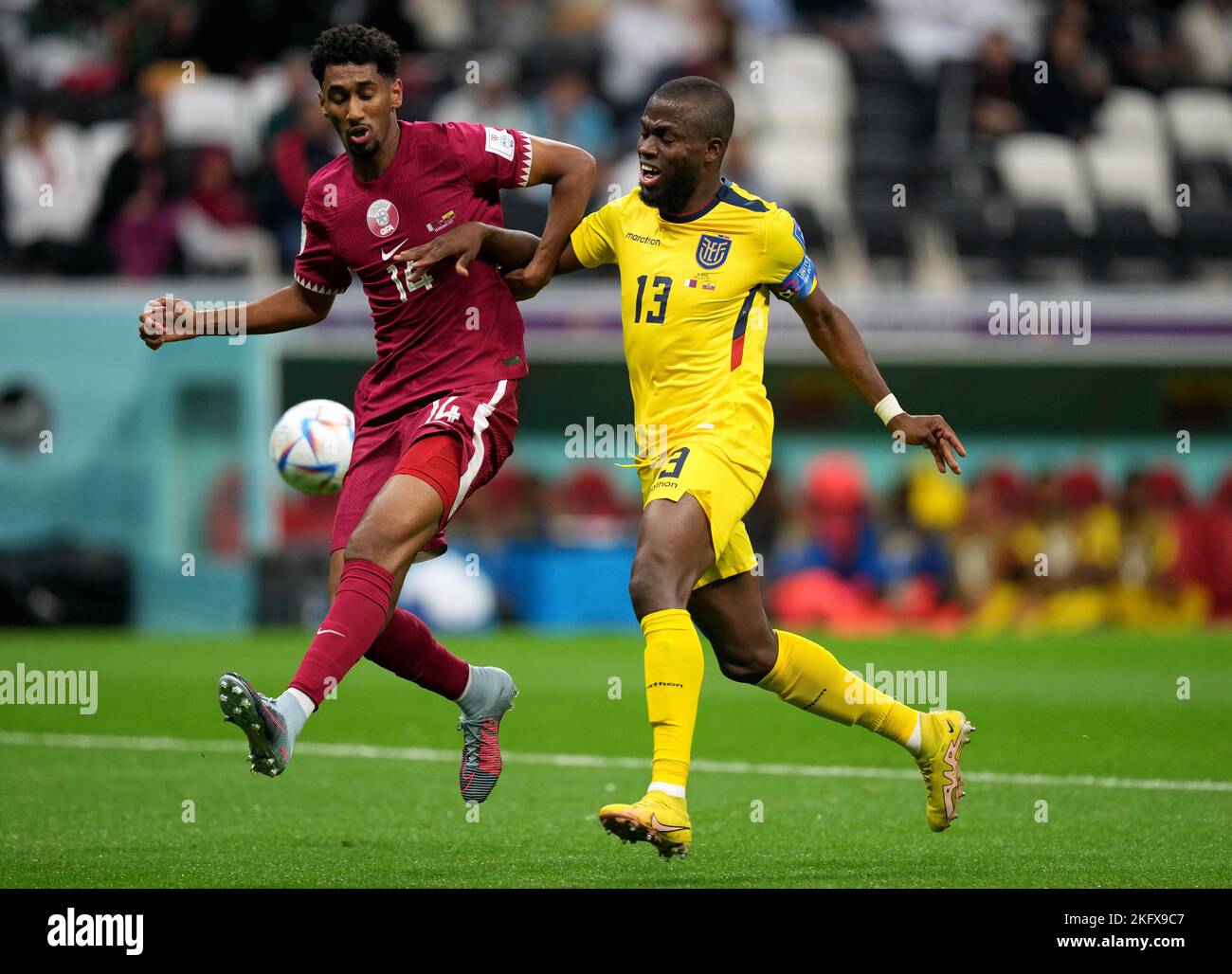 Qatars Homam Ahmed And Ecuadors Enner Valencia Right Battle For The