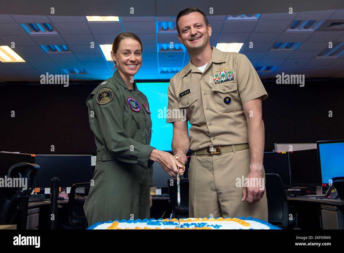 U.S. Navy Lt. Renata Kolinko, left, space battle manager for the Joint ...