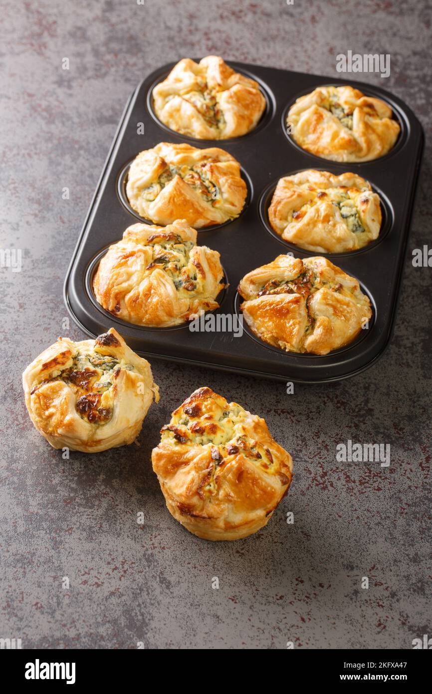 Homemade Spinach Muffin Puff with Feta and Onion closeup in the maffin ...