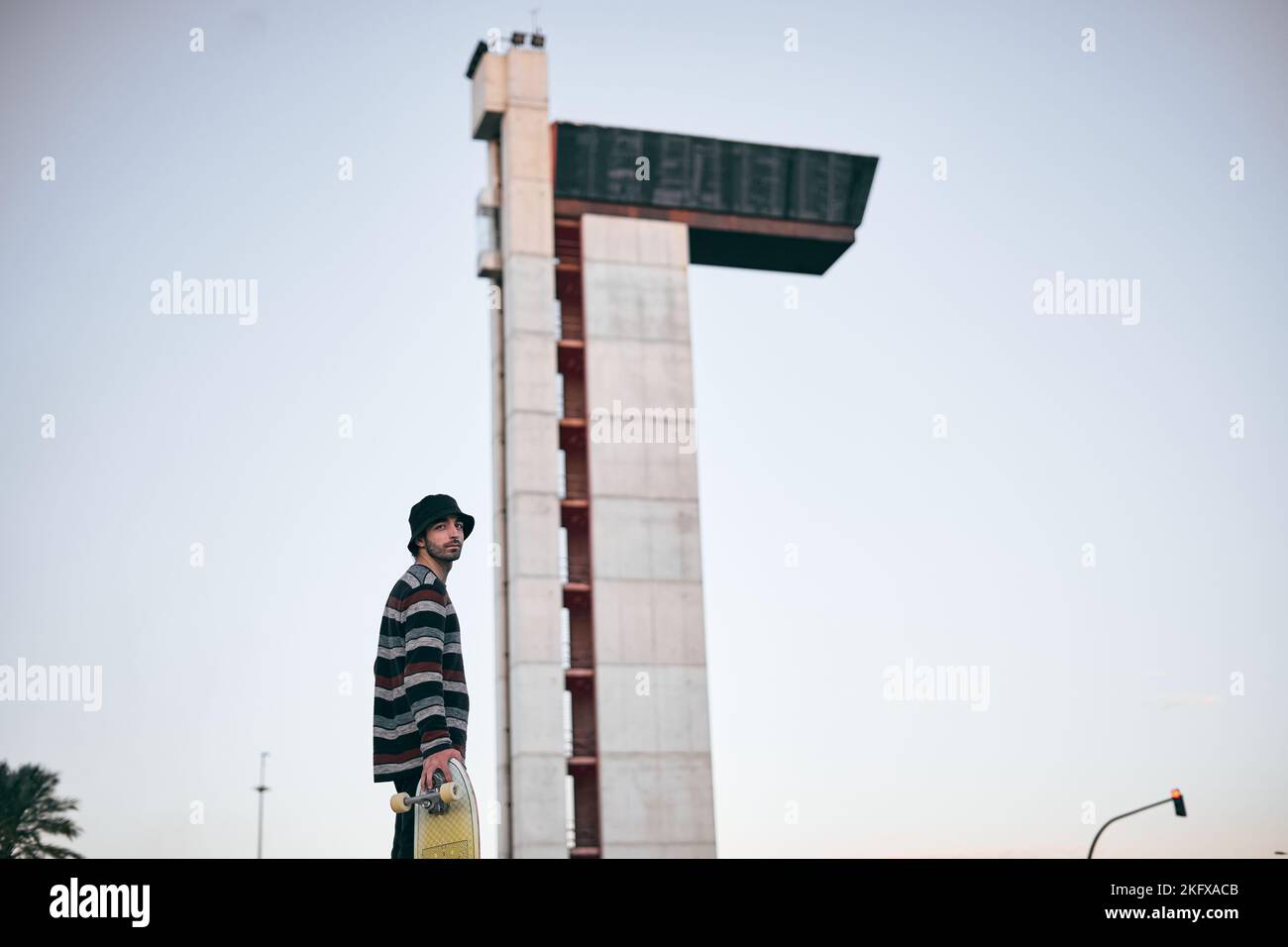 caucasian guy in striped sweater with nose piercing and cute beanie ...