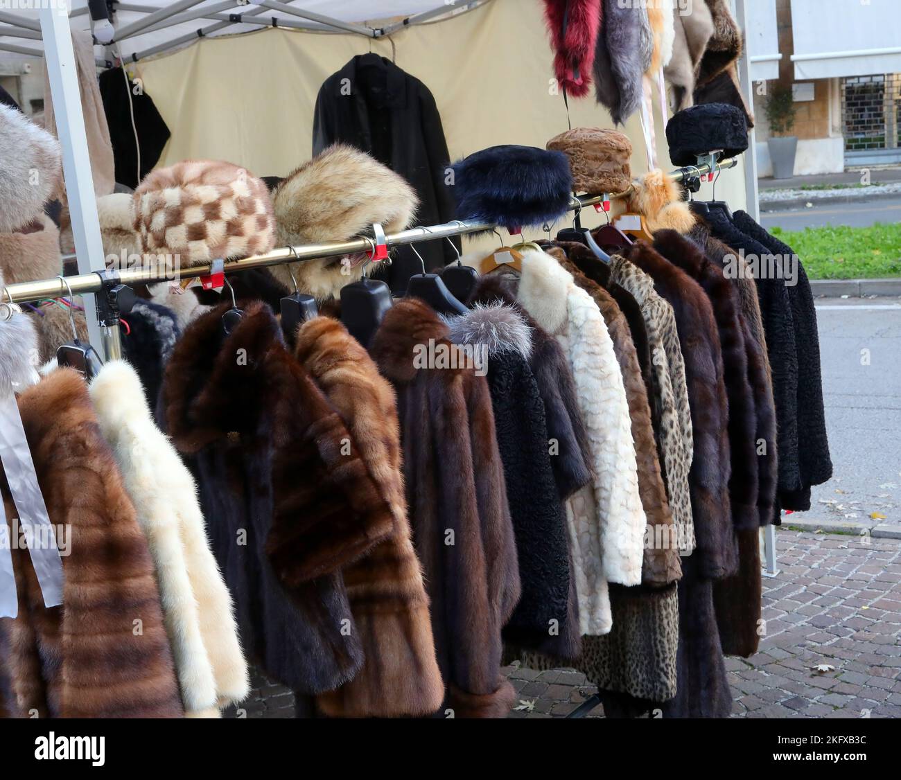 used fur and winter clothes for sale in the outdoor flea market stall ...