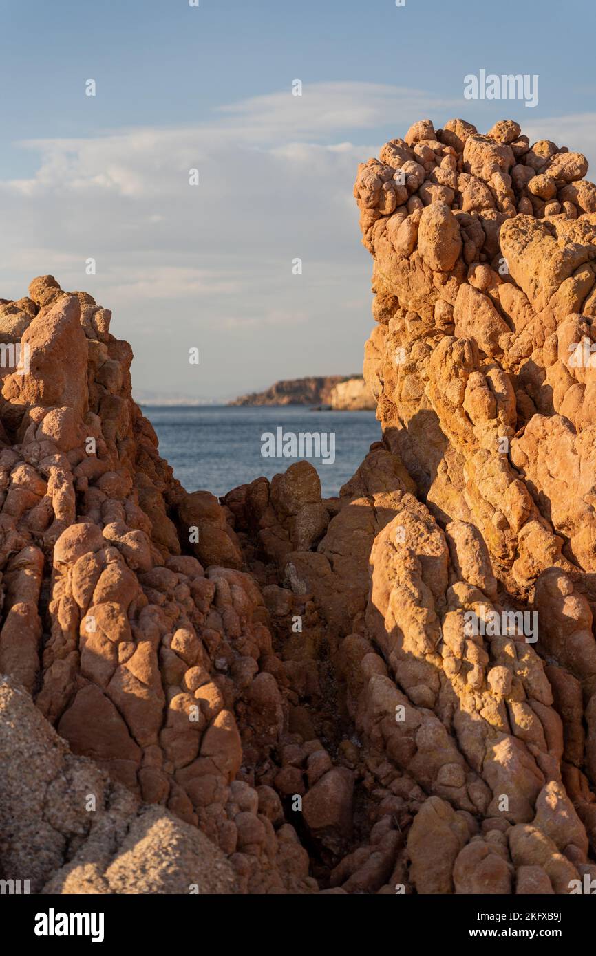 A big red rocks by the beach Stock Photo - Alamy
