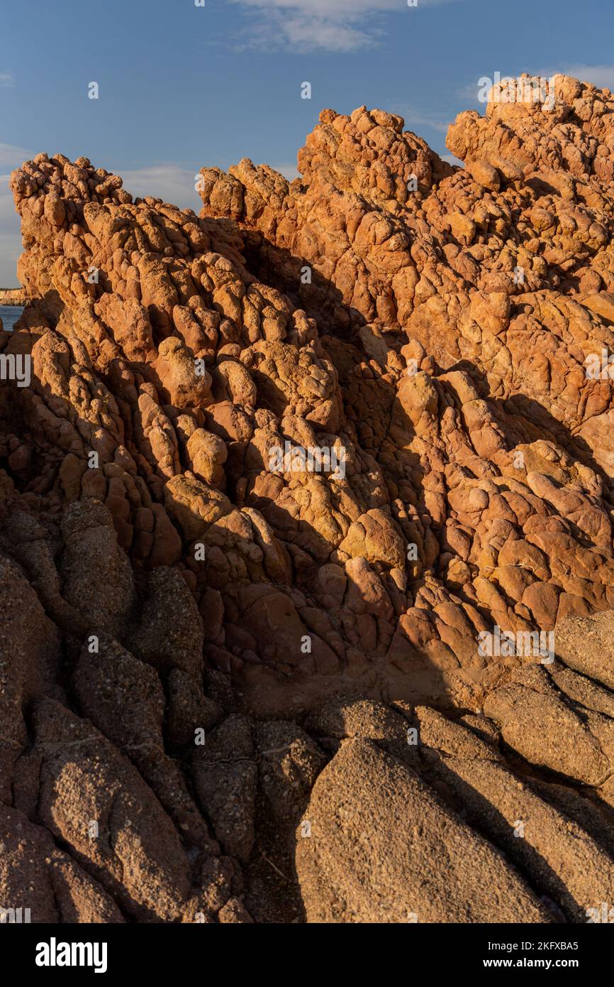 A big red rocks by the beach Stock Photo - Alamy