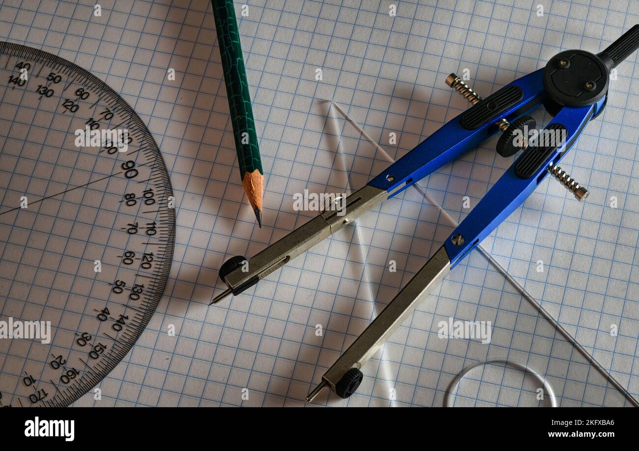 Drafting Tools on Grid Paper close up Stock Photo - Alamy