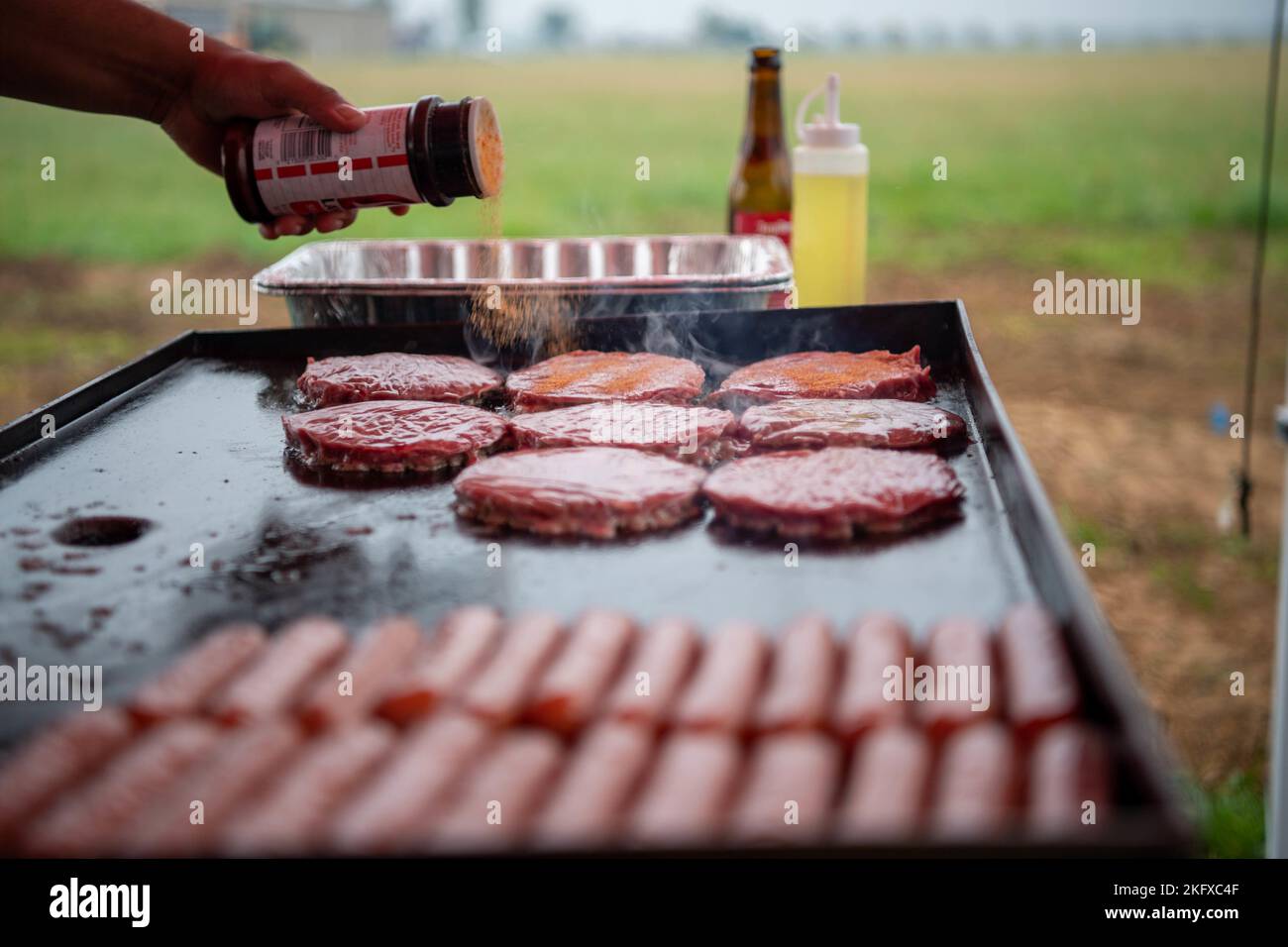 The 424th Air Base Squadron grill burgers and hot dogs for their 10 ...