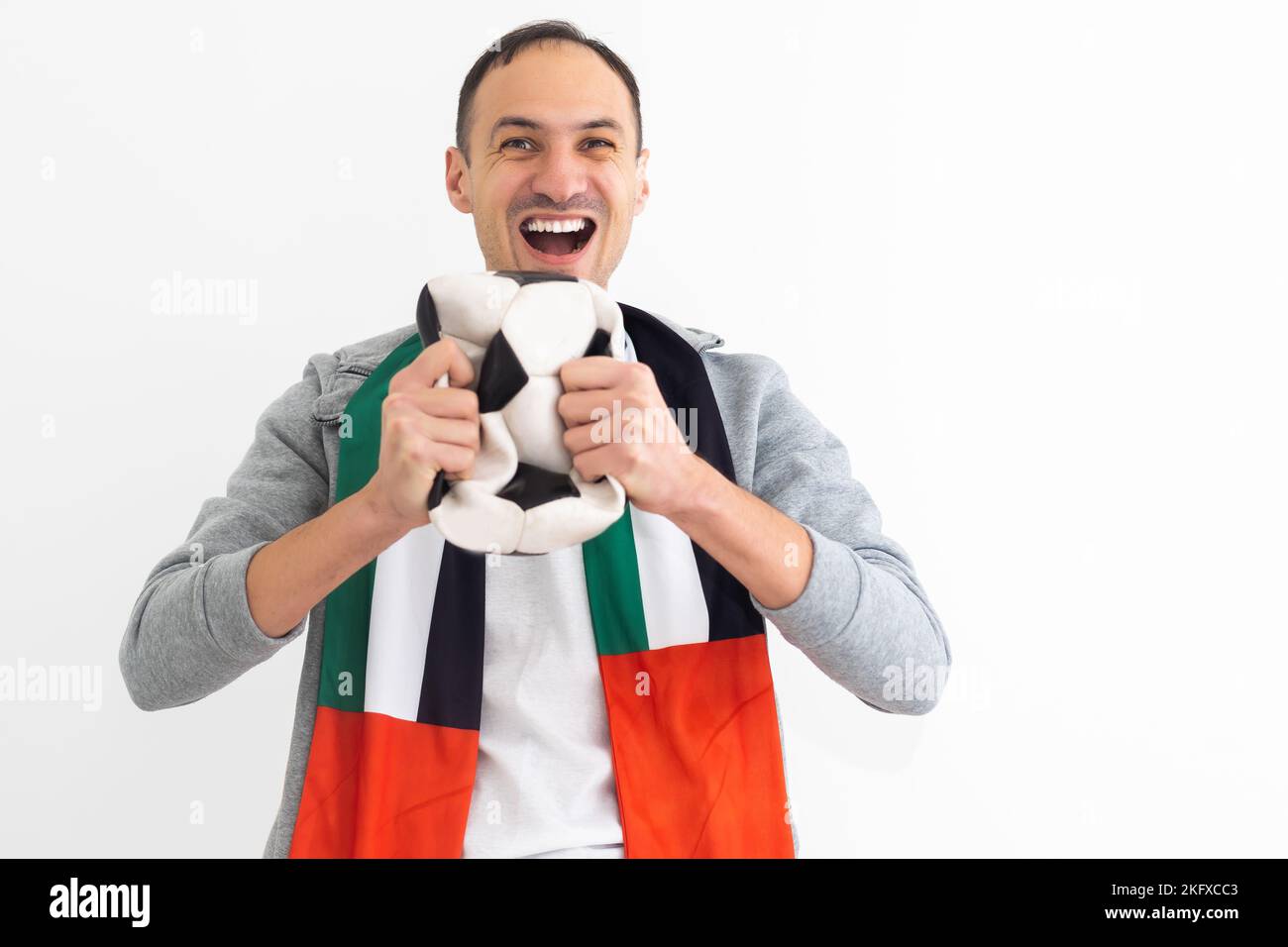 Young sad unhappy man fan in brown shirt hold remote controller spread ...