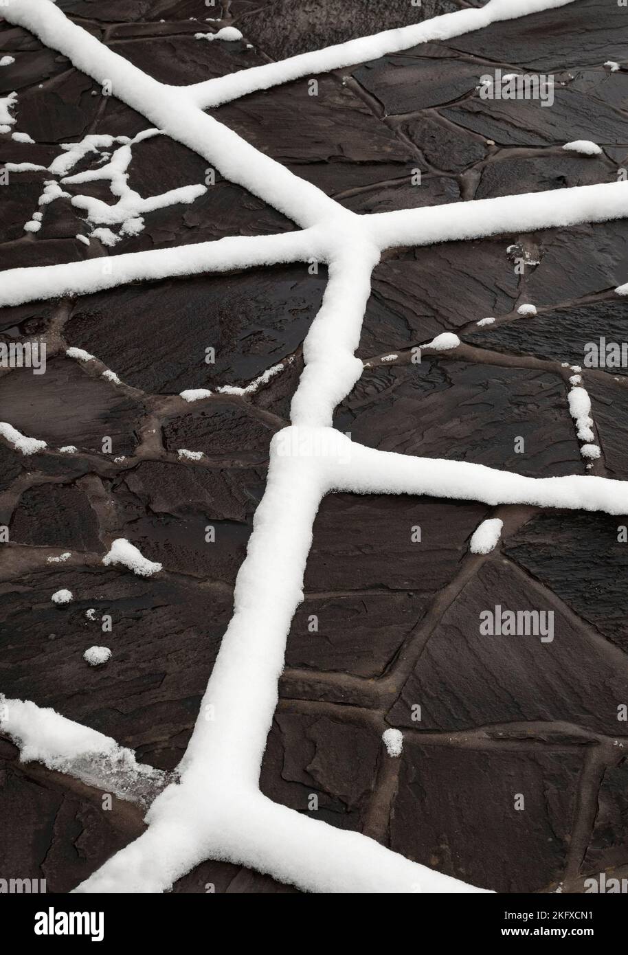 winter background stone paving with lines of snow Stock Photo - Alamy