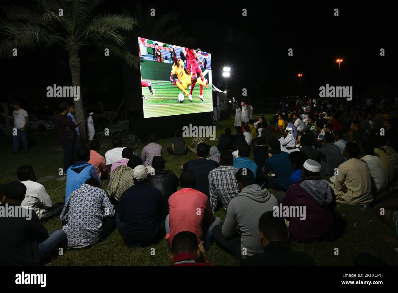 Al Ruwais, Qatar. 20th Nov, 2022. Residents of Al-Ruwais watch the ...