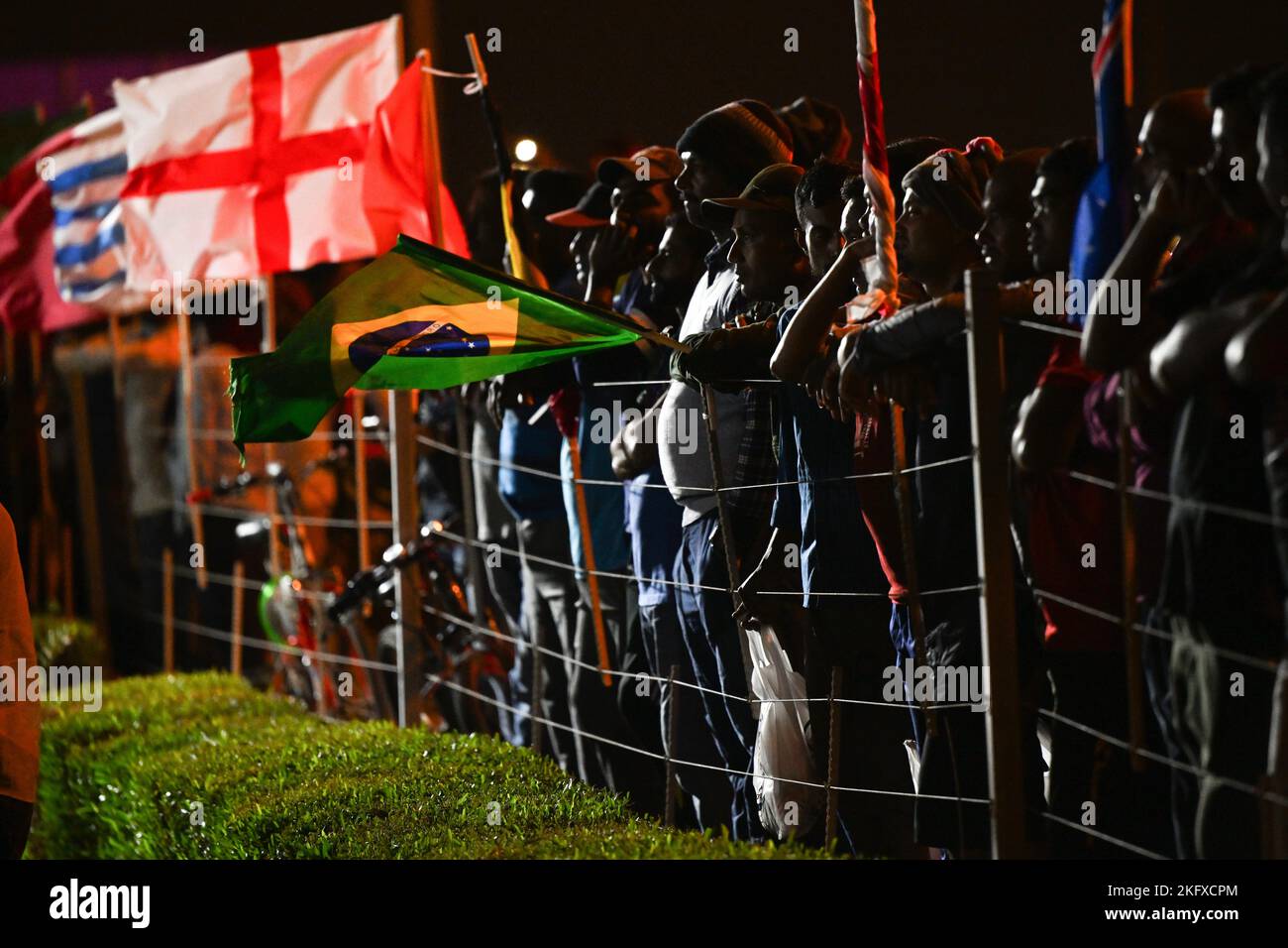Al Ruwais, Qatar. 20th Nov, 2022. Residents of Al-Ruwais watch the ...