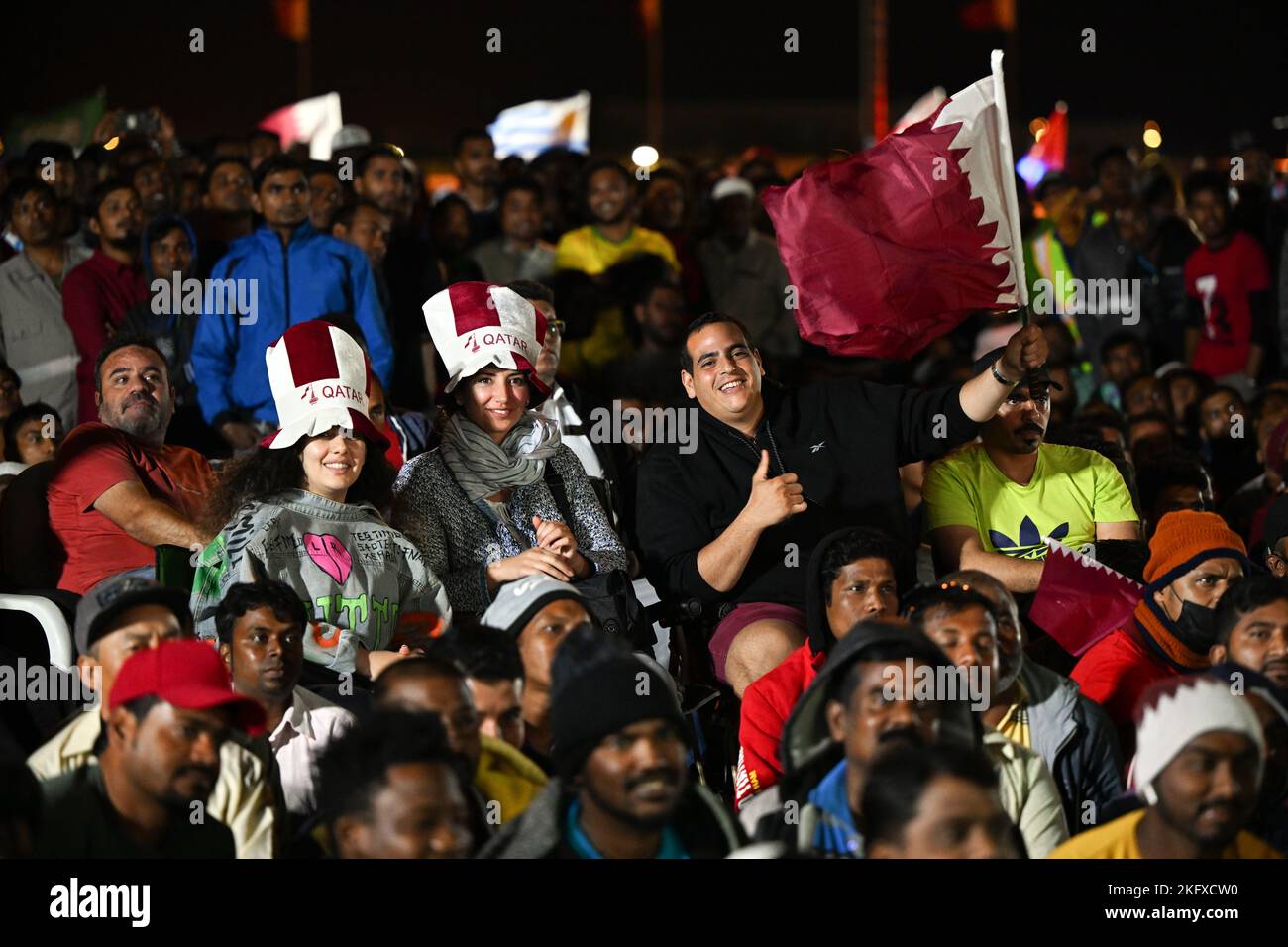 Al Ruwais, Qatar. 20th Nov, 2022. Residents of Al-Ruwais watch the ...